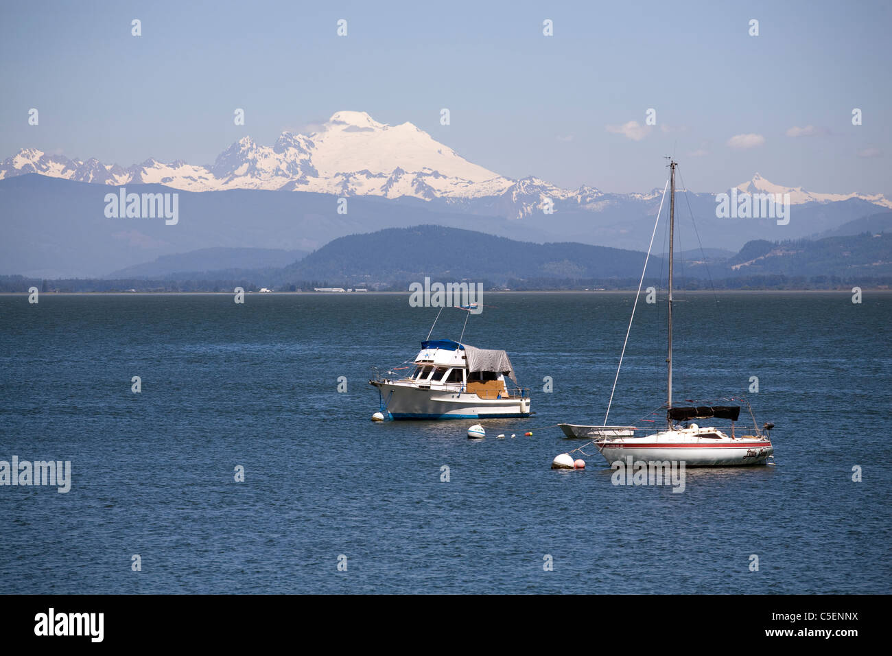 Yachts on Puget Sound, Washington, with the North Cascades National ...
