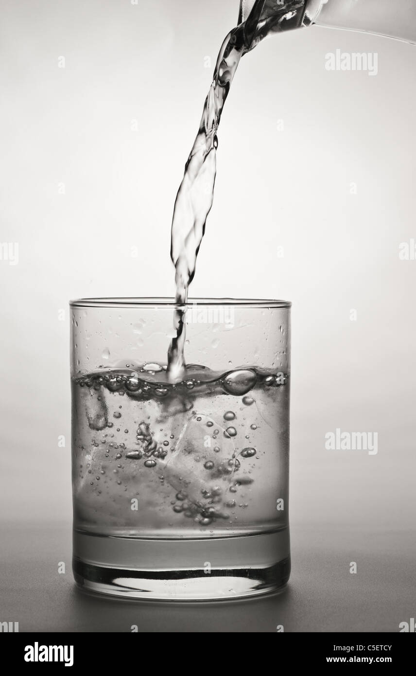 water being poured into glass Stock Photo - Alamy