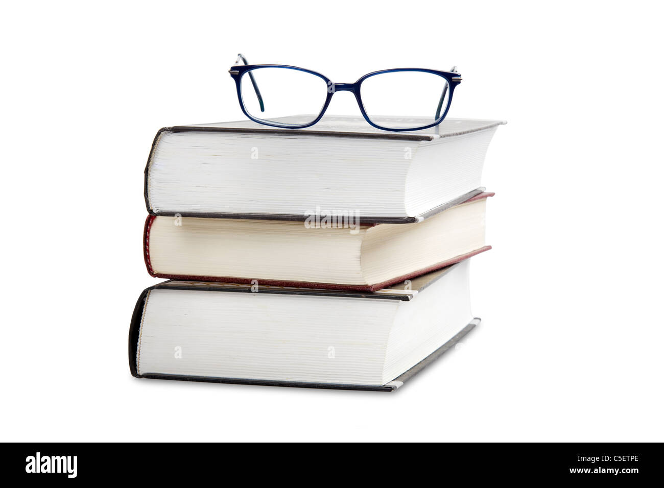 Book stack with eye glasses Stock Photo - Alamy
