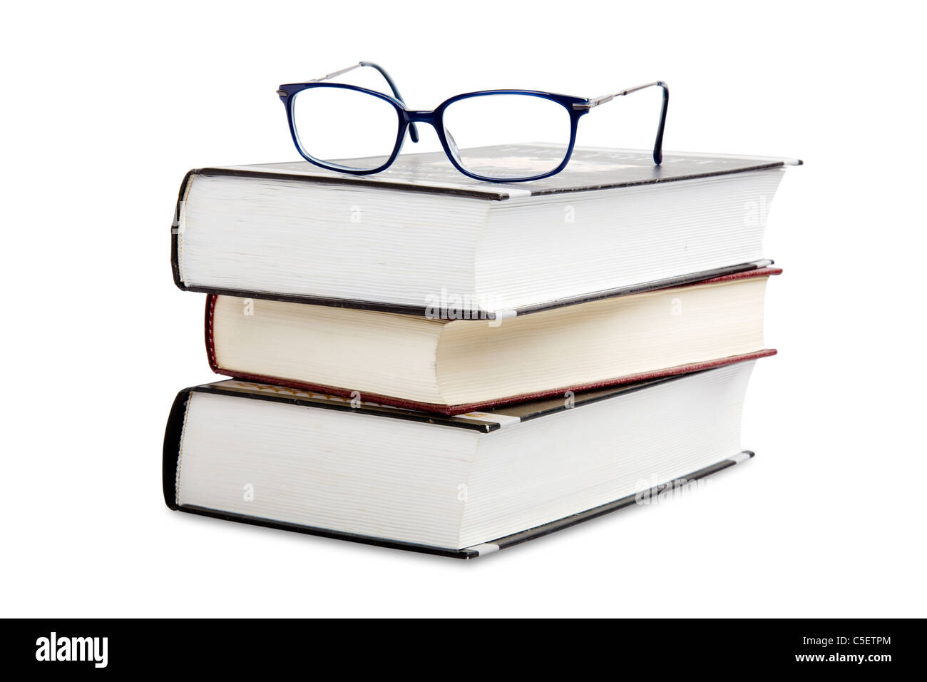 Book stack with eye glasses Stock Photo - Alamy