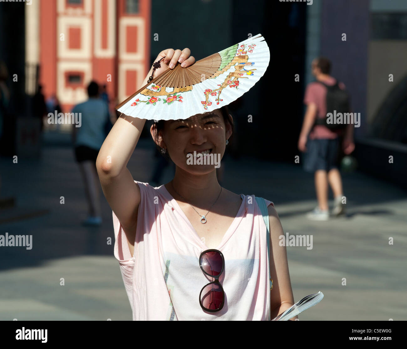 Japanese girl with fan and glasses Stock Photo - Alamy