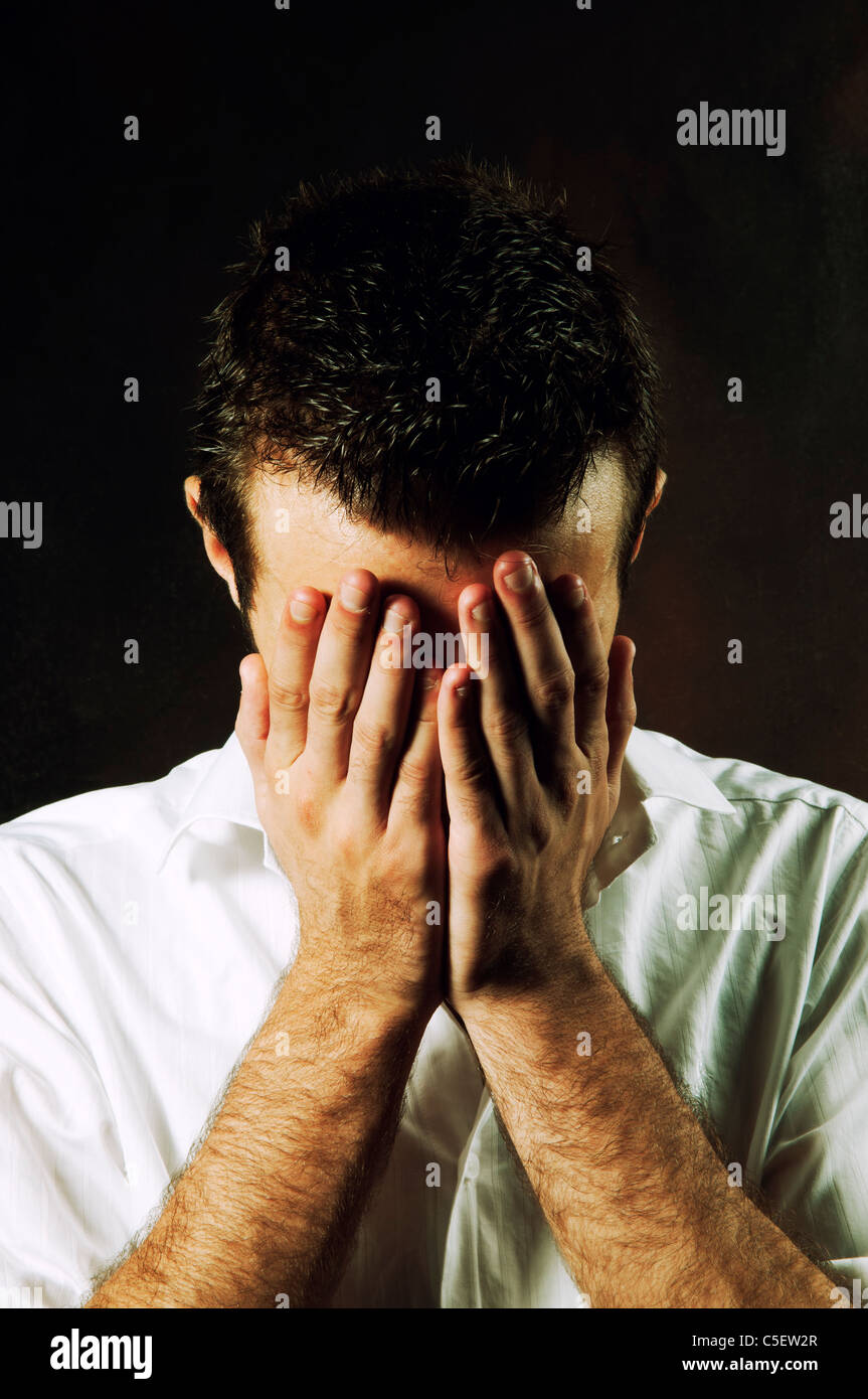 Man crying head in hands hi-res stock photography and images - Alamy