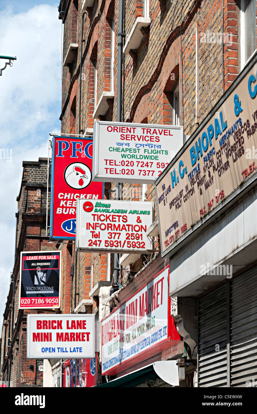 famous curry restaurant signs down brick lane in the east end of london ...