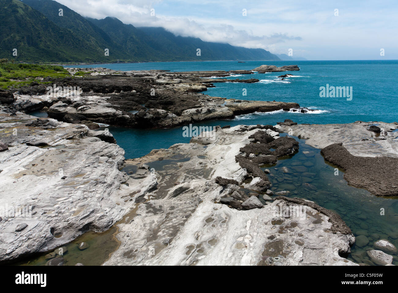 Scenic overlook along a rocky terrace coastline seen from Shitiping ...