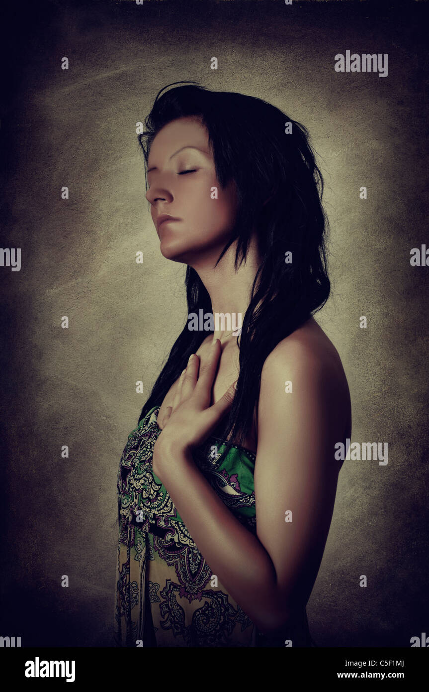 Sad woman hand over chest Stock Photo - Alamy