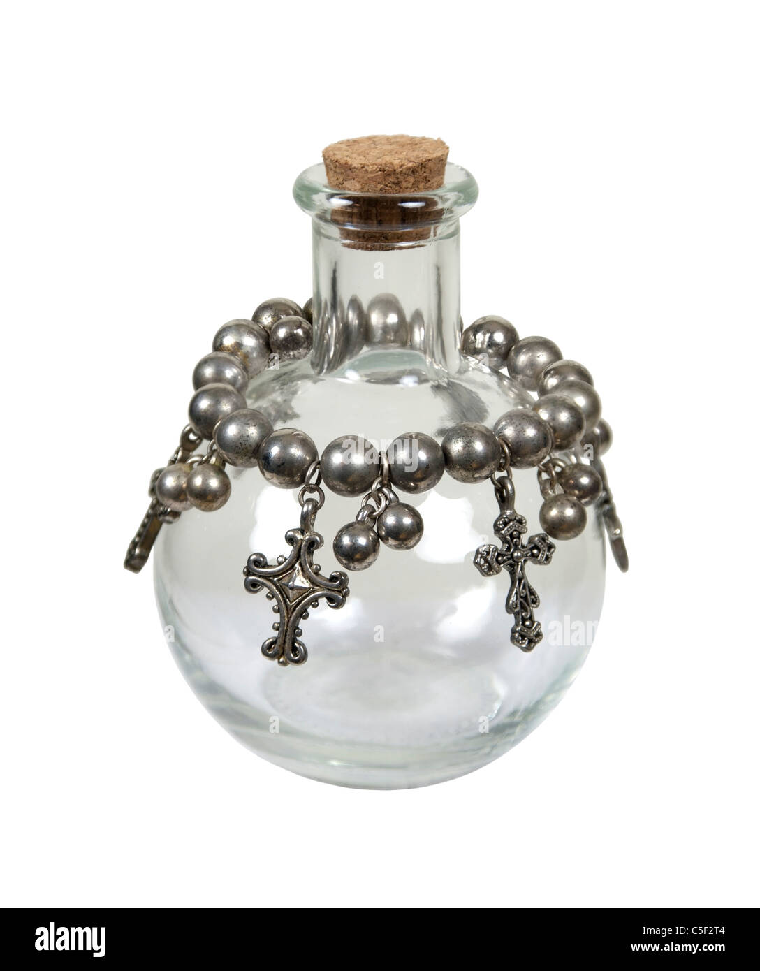 Spirituality potion shown by silver crosses hanging from a glass bottle ...