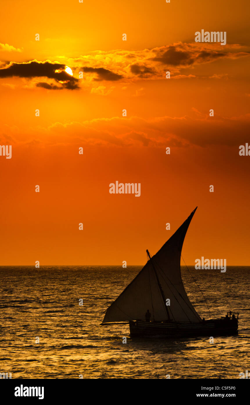 The shot of a classic Dhow boat of Zanzibar on sunset Stock Photo - Alamy