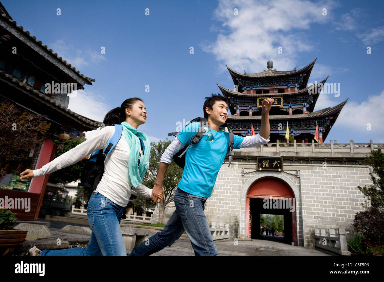 Young Couple Running Through Dali Stock Photo - Alamy