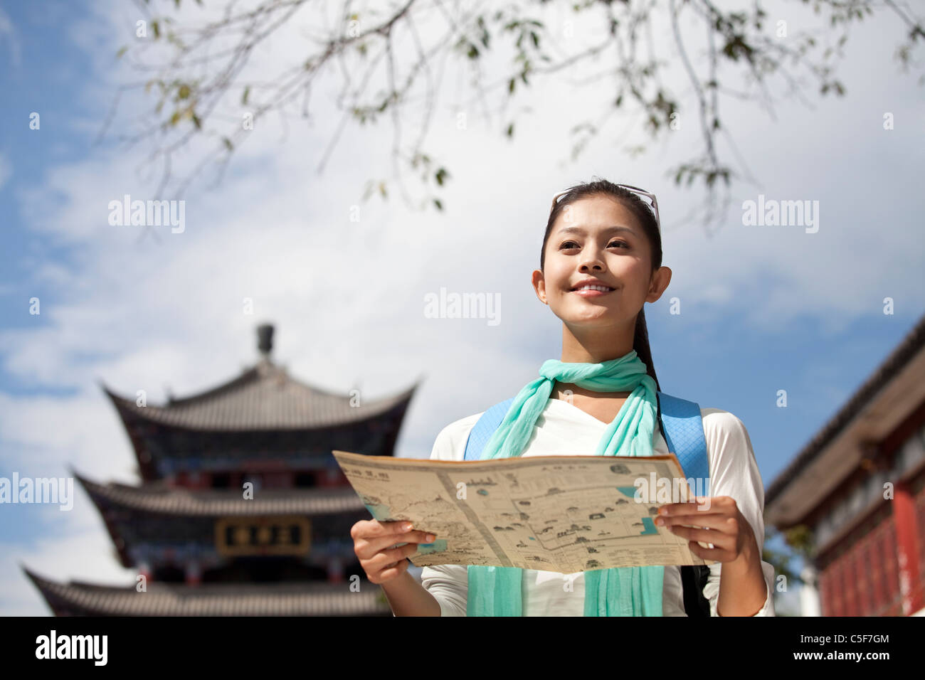 Young Woman Exploring Dali with Map Stock Photo - Alamy