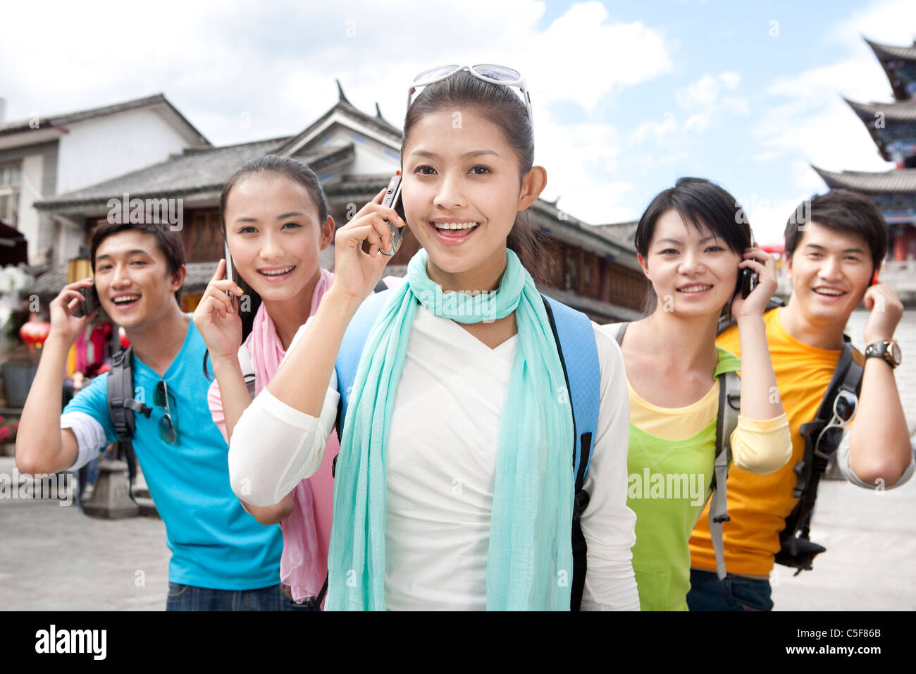 Young adults using cellphones hi-res stock photography and images - Alamy