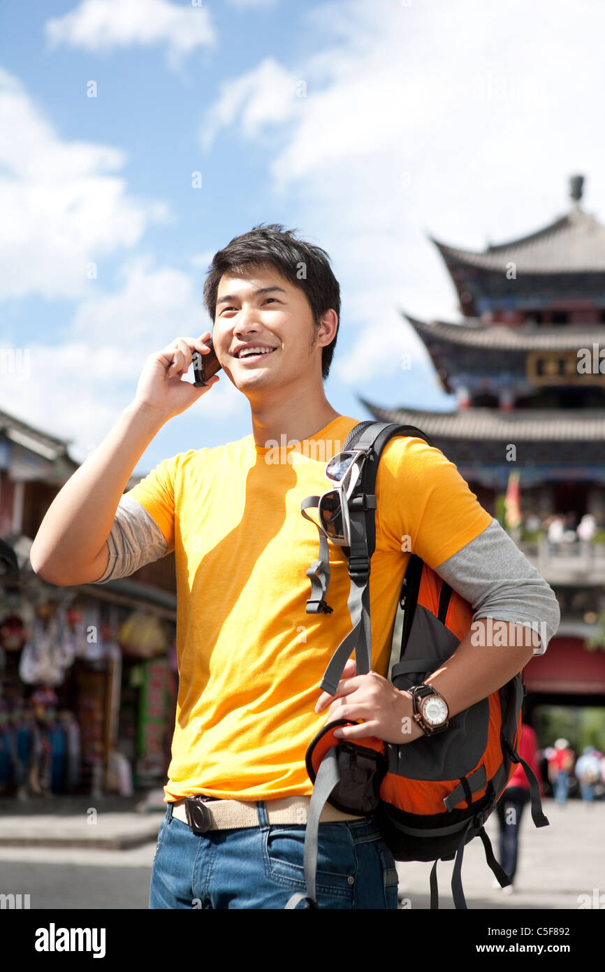 Young man using cellphone Stock Photo - Alamy