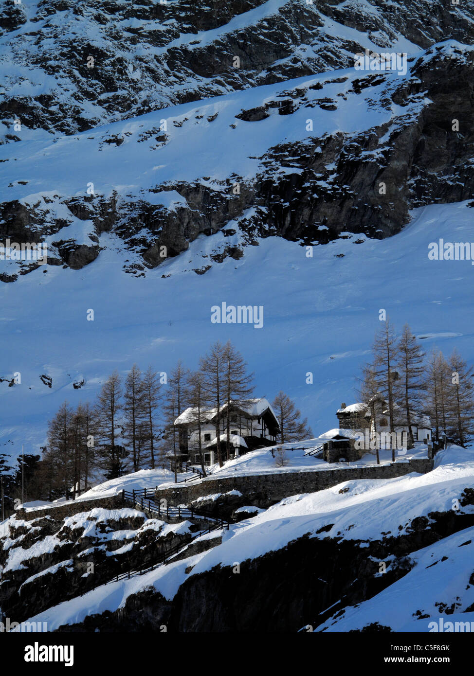 Dusk over mountainside buildings in the Italian ski resort of Cervinia ...