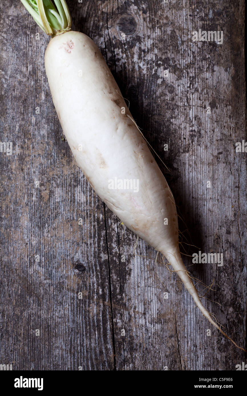 single radish on a wooden plank Stock Photo - Alamy