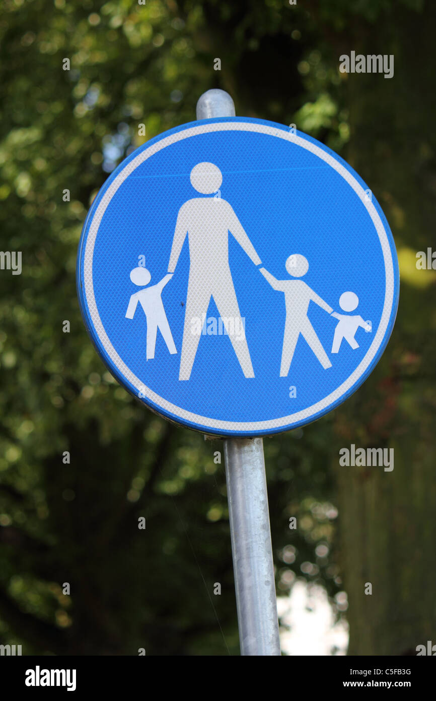 a traffic sign meaning footpath / walkway, with two more children added ...