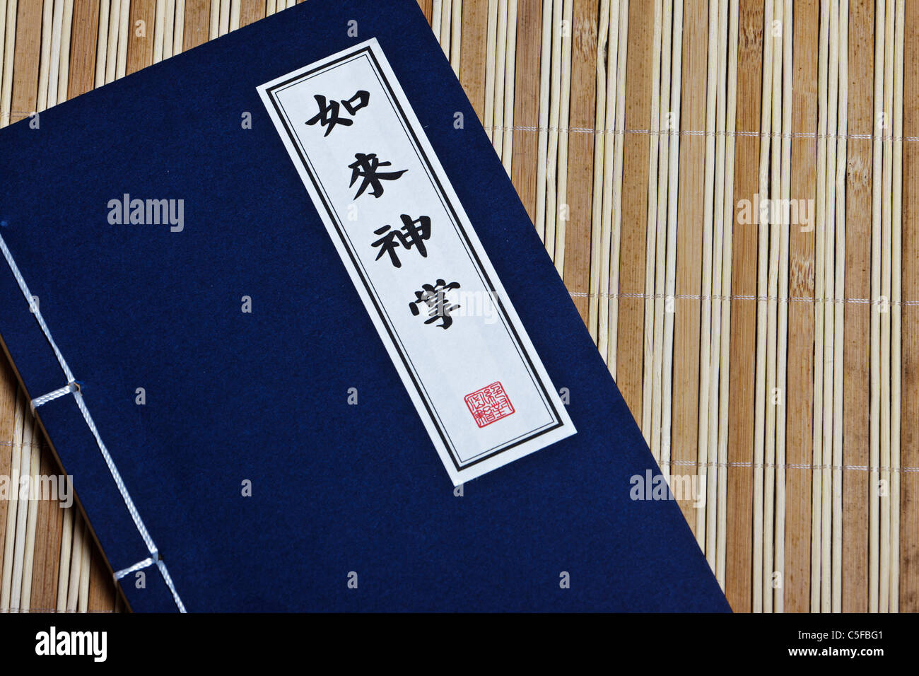Blue Chinese notebook against a bamboo background Stock Photo - Alamy