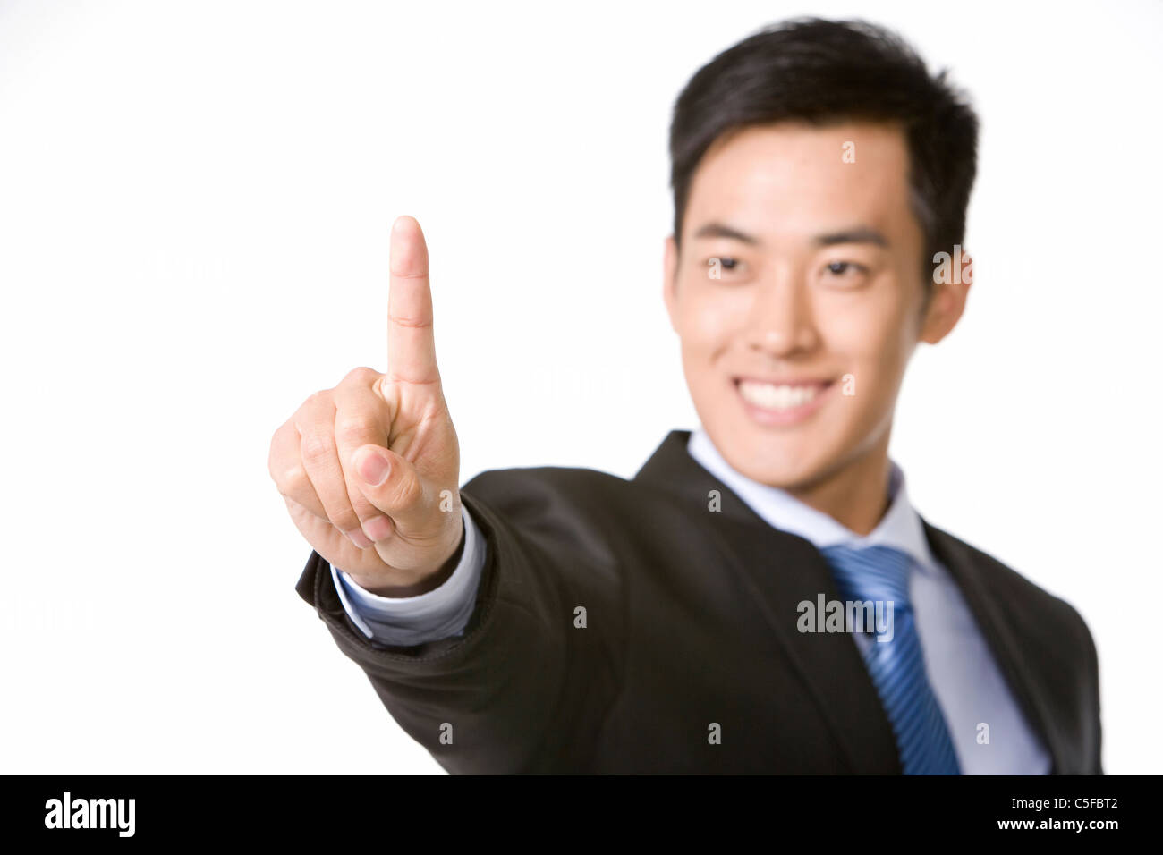 Businessman using finger to point Stock Photo - Alamy