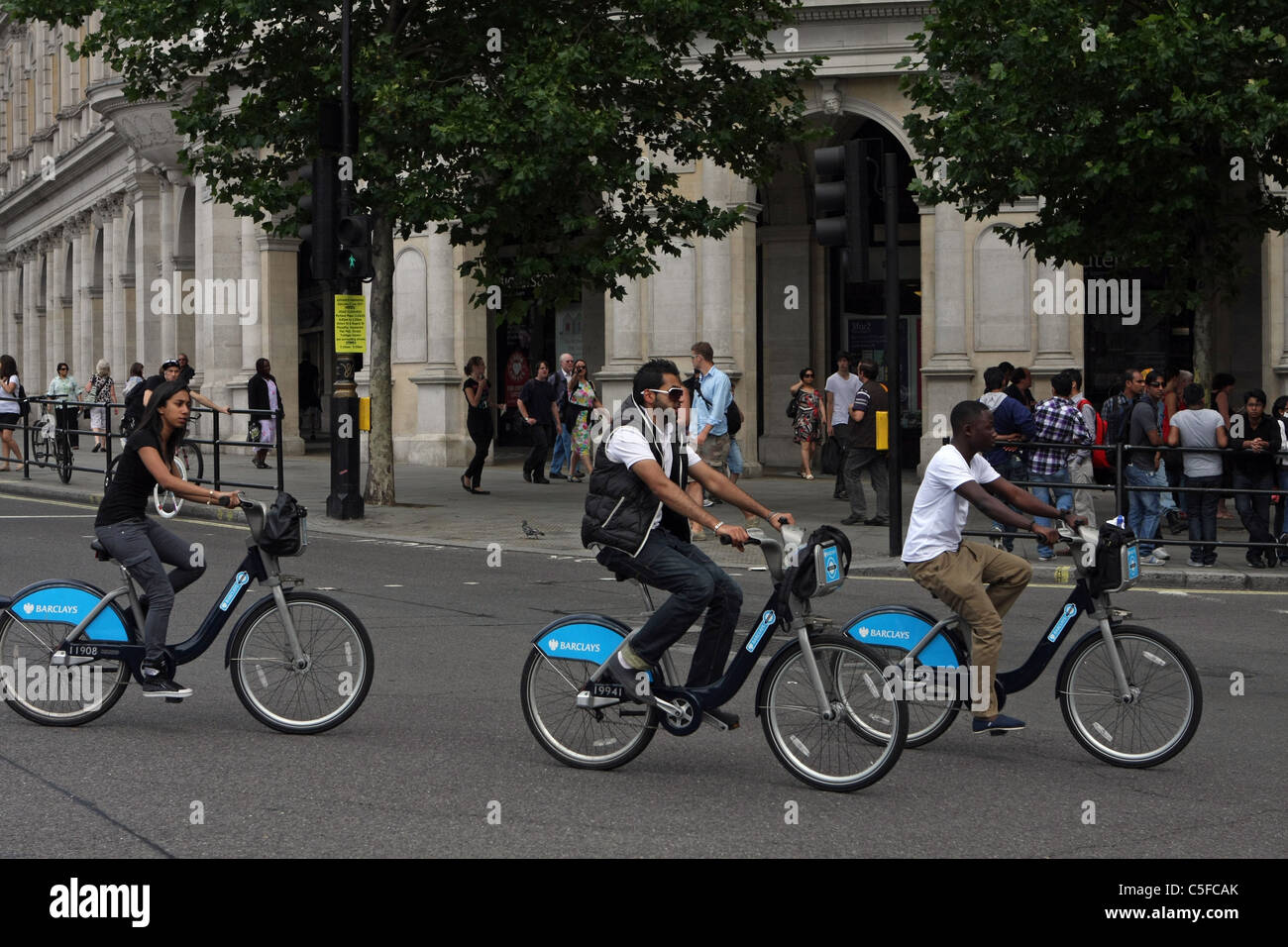 Rear view of 3 males riding bikes hi-res stock photography and images ...