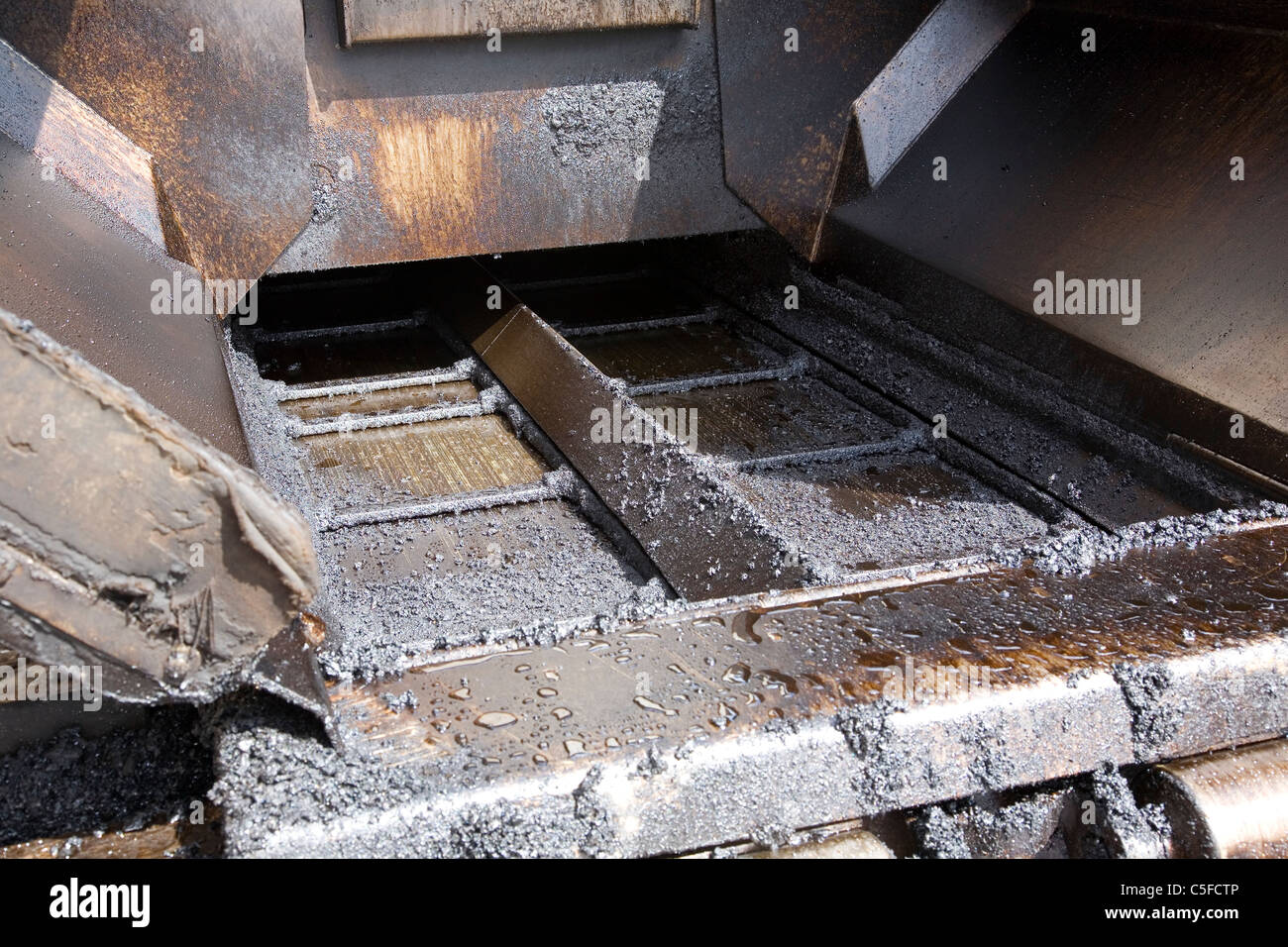Back of tar resurfacing vehicle Stock Photo - Alamy