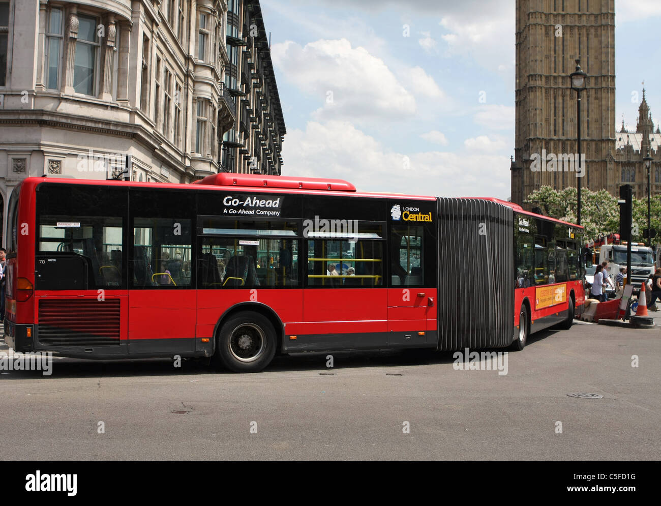A bus making a tight turn from Whitehall towards Westminster Bridge ...