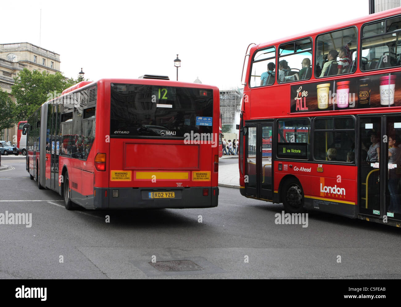 A bendy bus and double decker bus in traveling London Stock Photo - Alamy