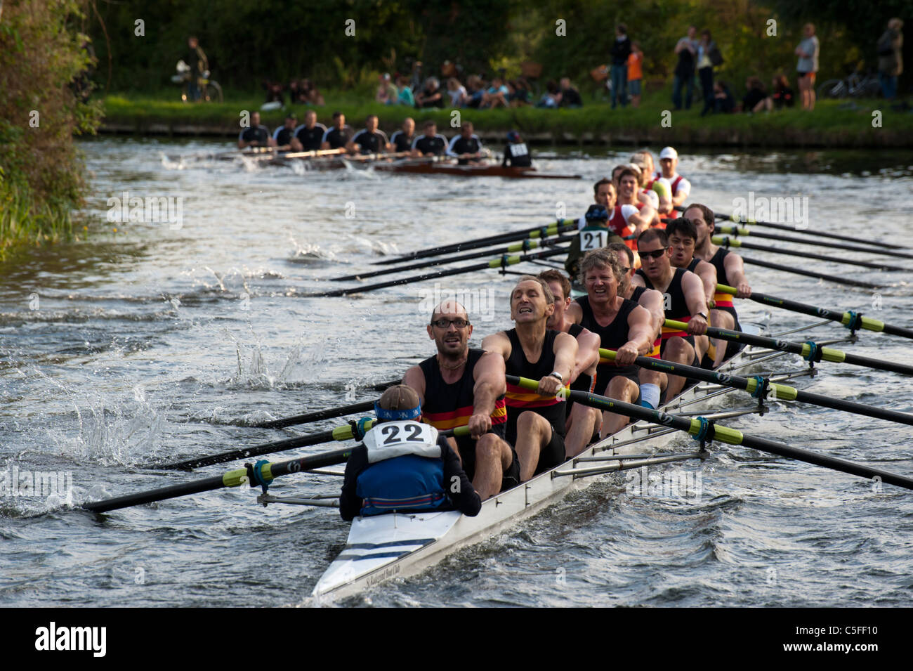 Men rowing in the Cambridge Bumps. Shows exertion on competitors faces ...