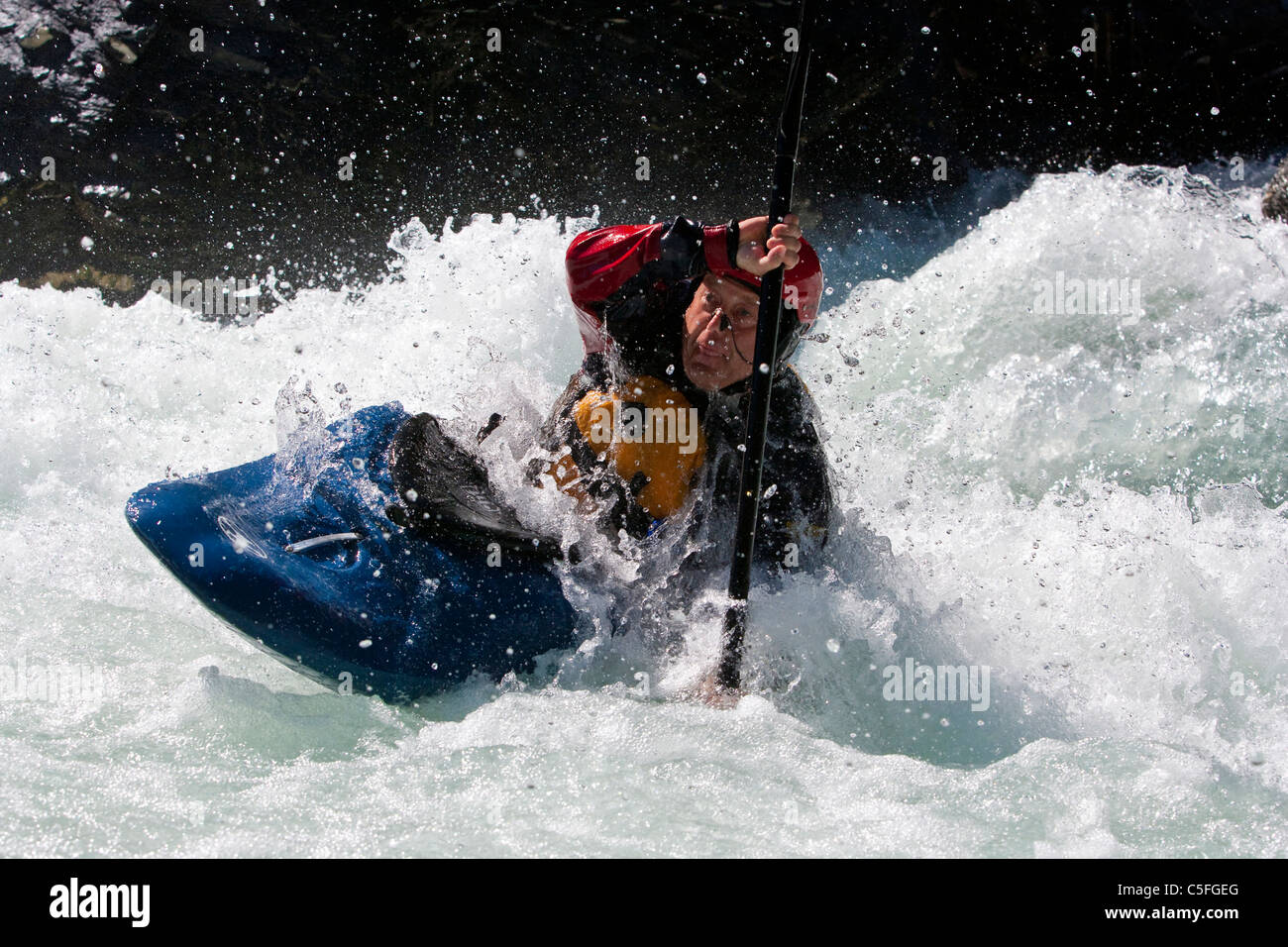 Whitewater kayaker riding class IV rapid on Inn River near Pfunds ...