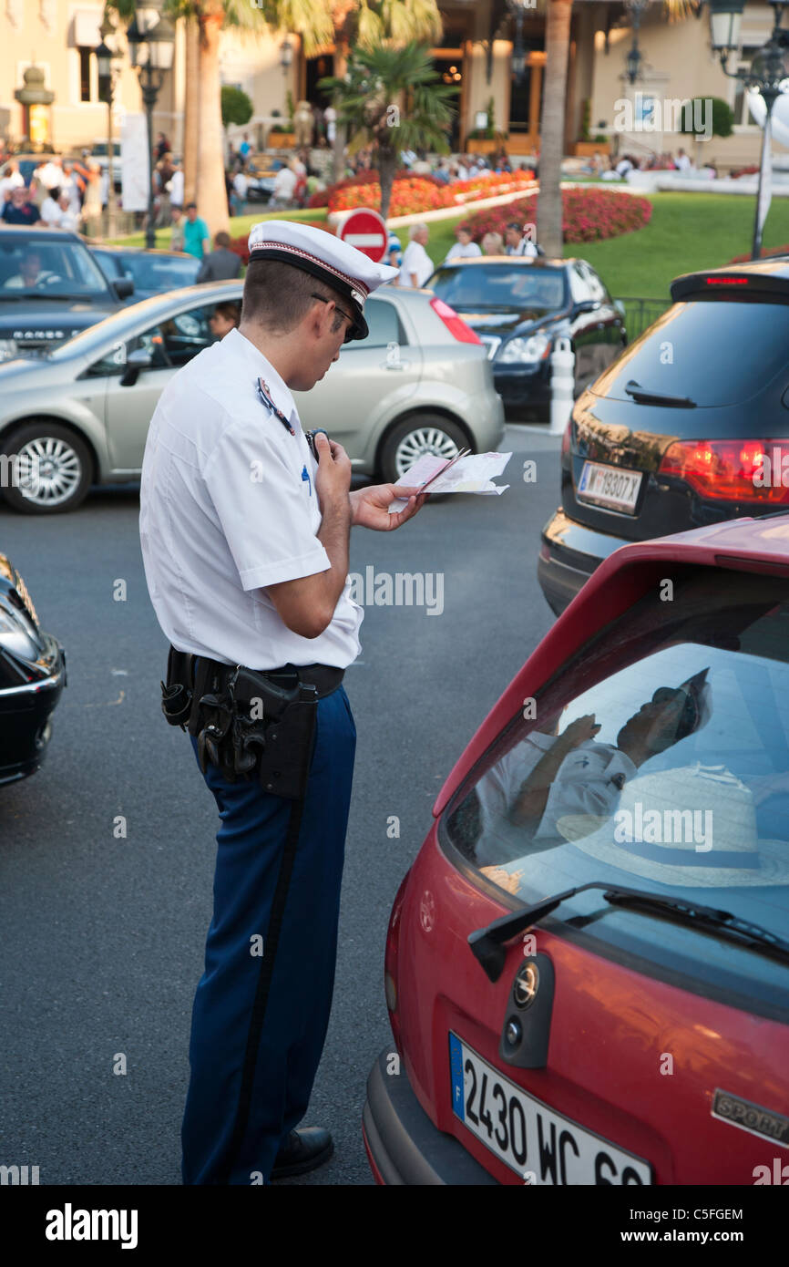 Policeman investigating wrongly parked car, Monte Carlo, Monaco Stock ...