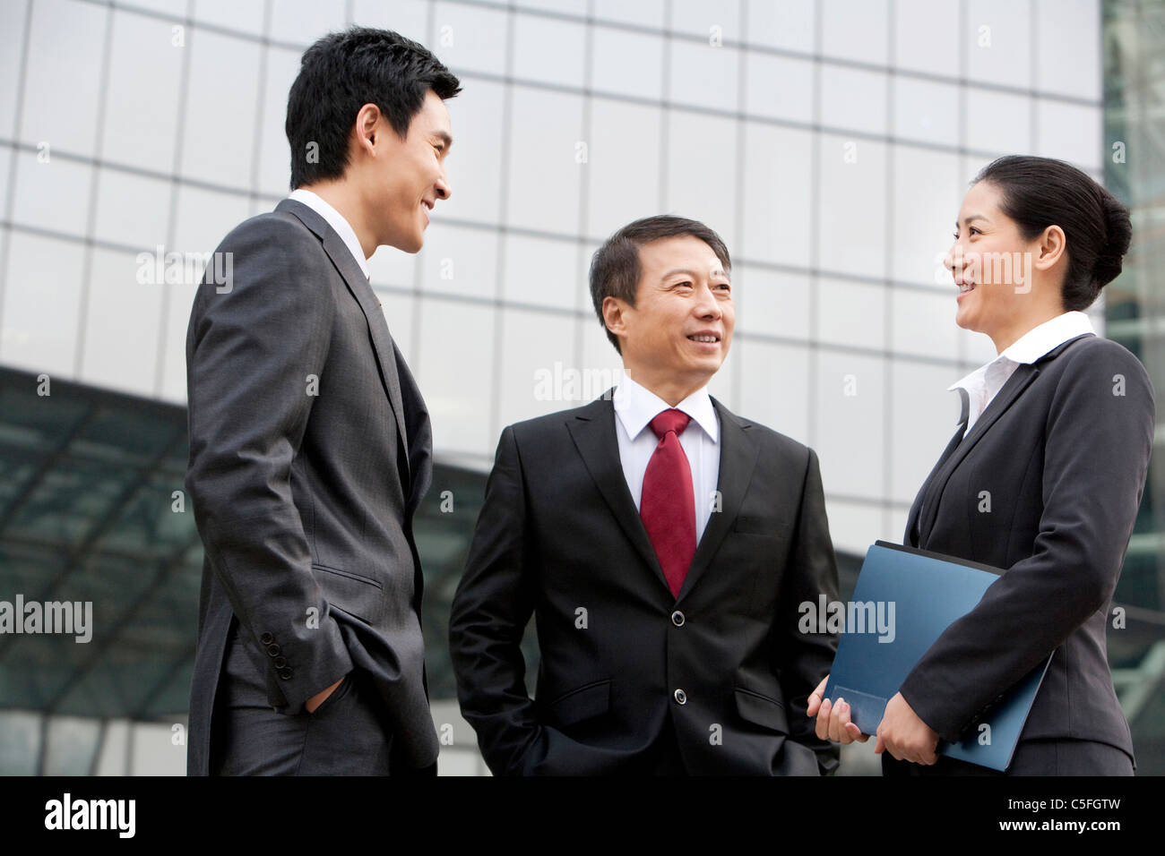 Businessmen in discussion Stock Photo - Alamy