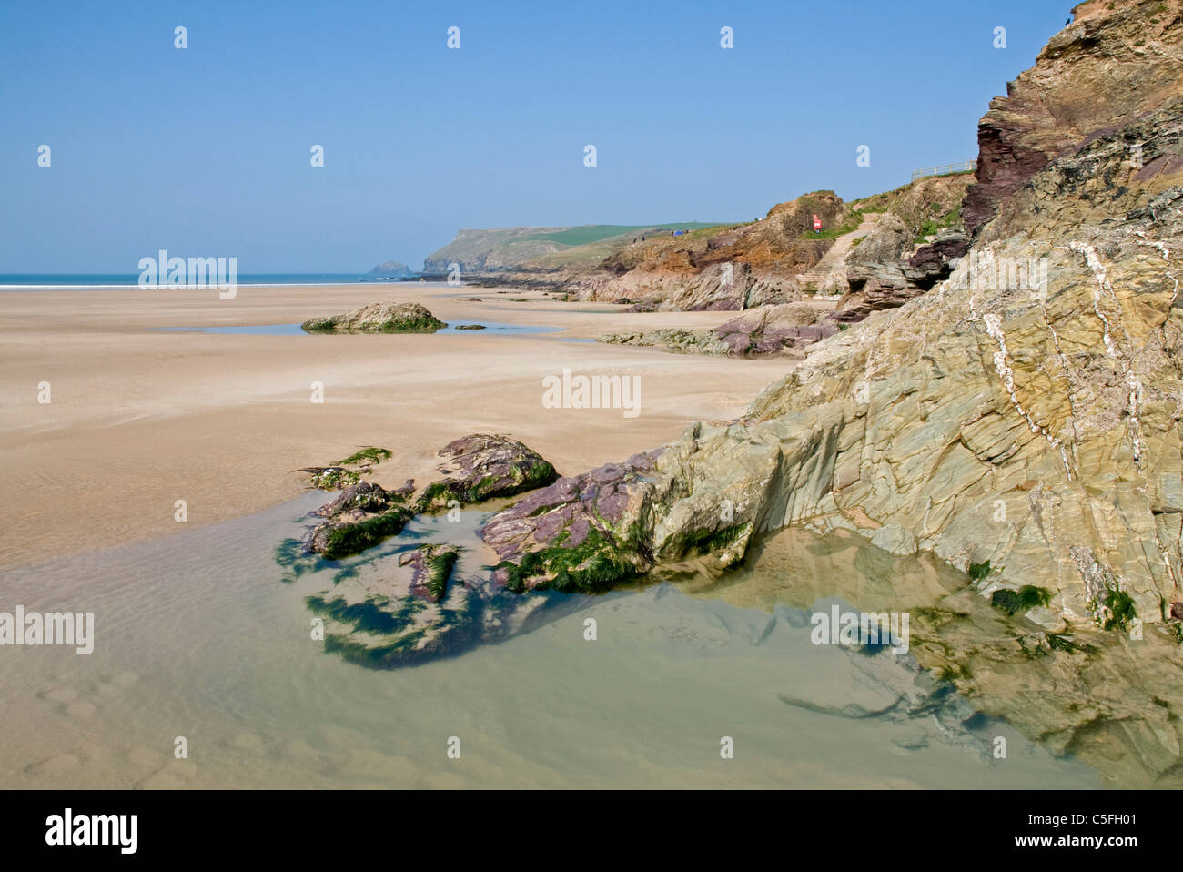 On the beach at Hayle Bay, Polzeath, north Cornwall, with Pentire Point ...