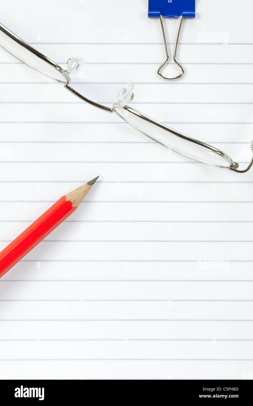 Pencil on a notepad with paperclip Stock Photo - Alamy
