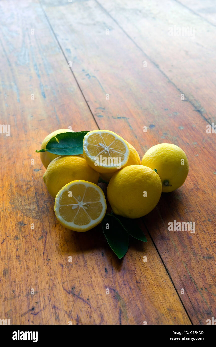 lemons on old table top Stock Photo - Alamy