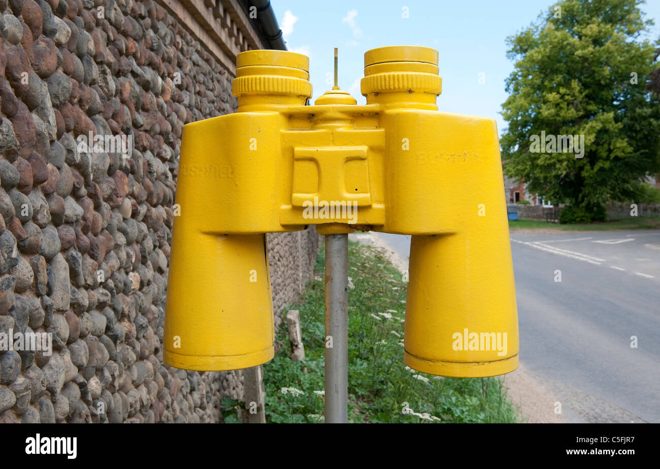 large yellow binoculars roadside sign Stock Photo - Alamy