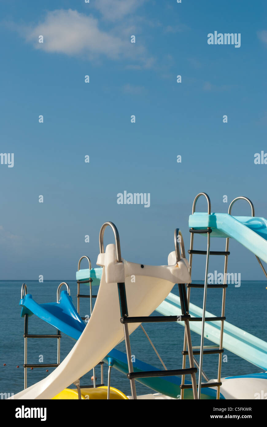 Several slides under the sun, waiting for beach fun Stock Photo - Alamy