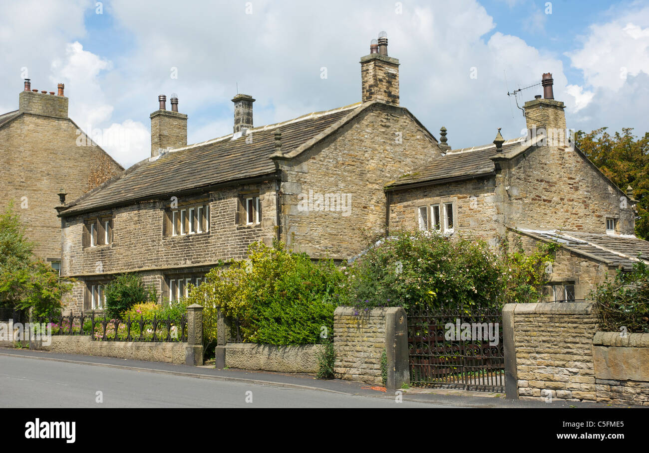 Old stone cottage in the village of Cononley, North Yorkshire, England ...