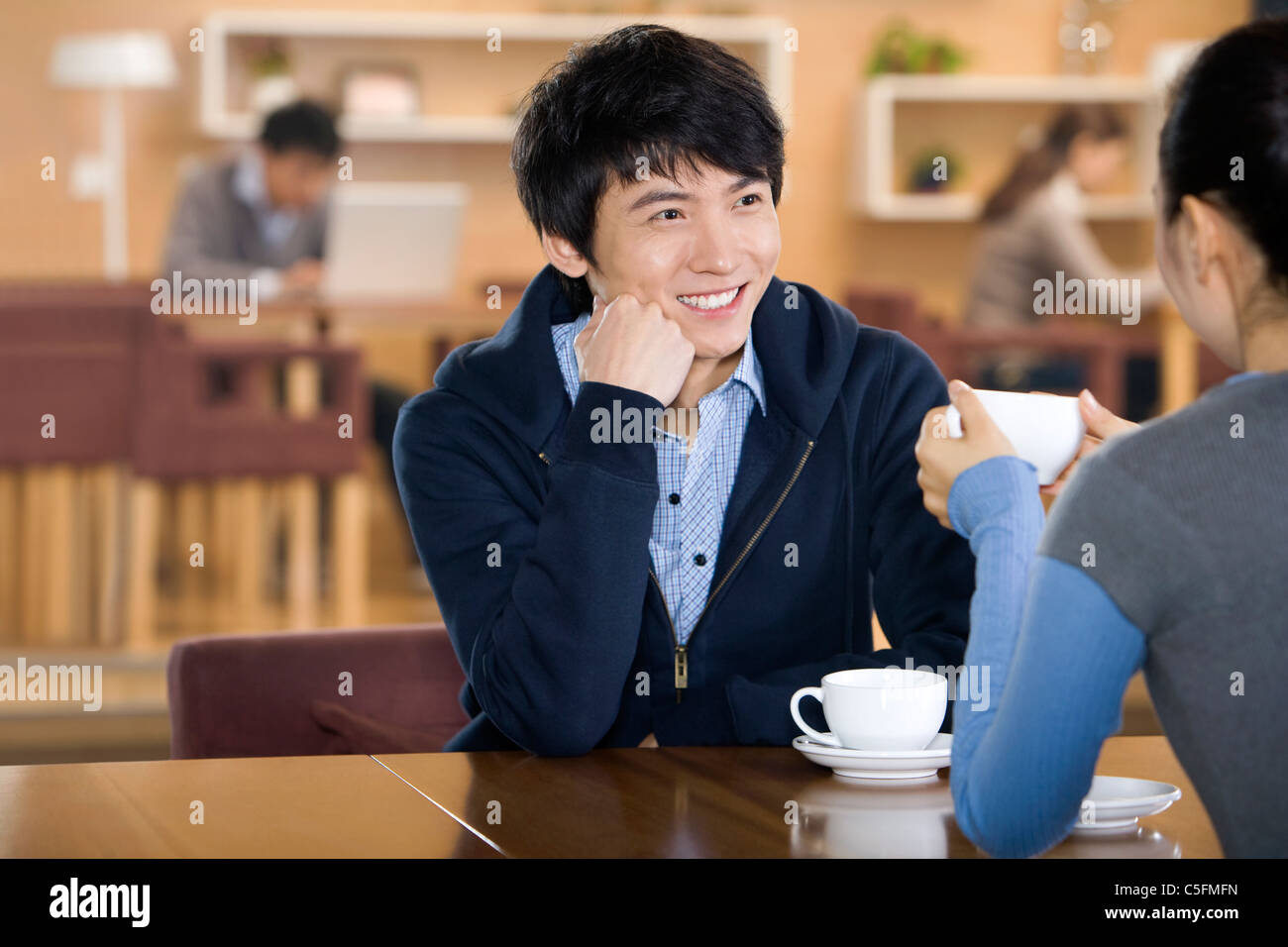 Man and woman talking over coffee Stock Photo - Alamy