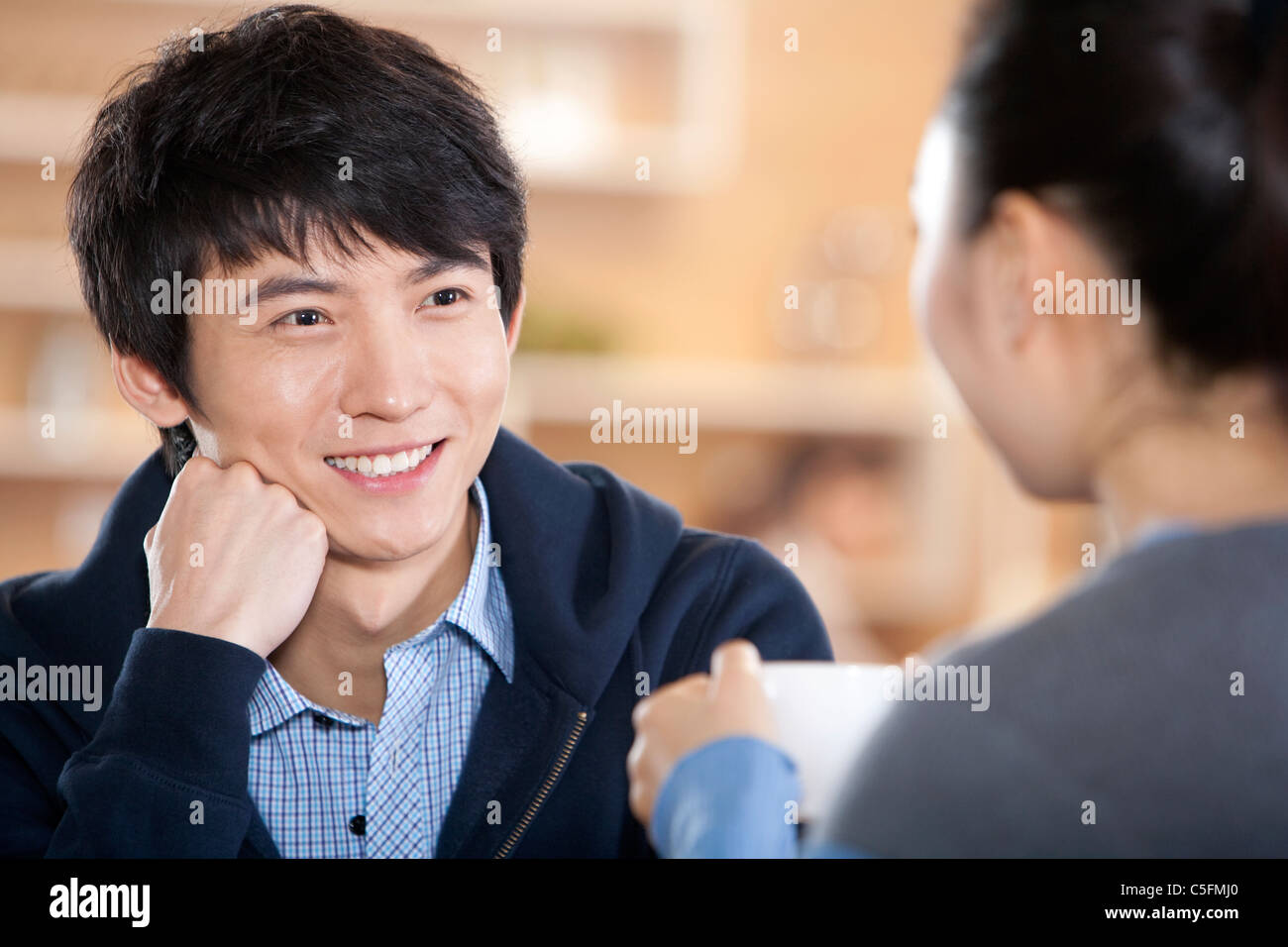 Man and woman talking over coffee Stock Photo - Alamy