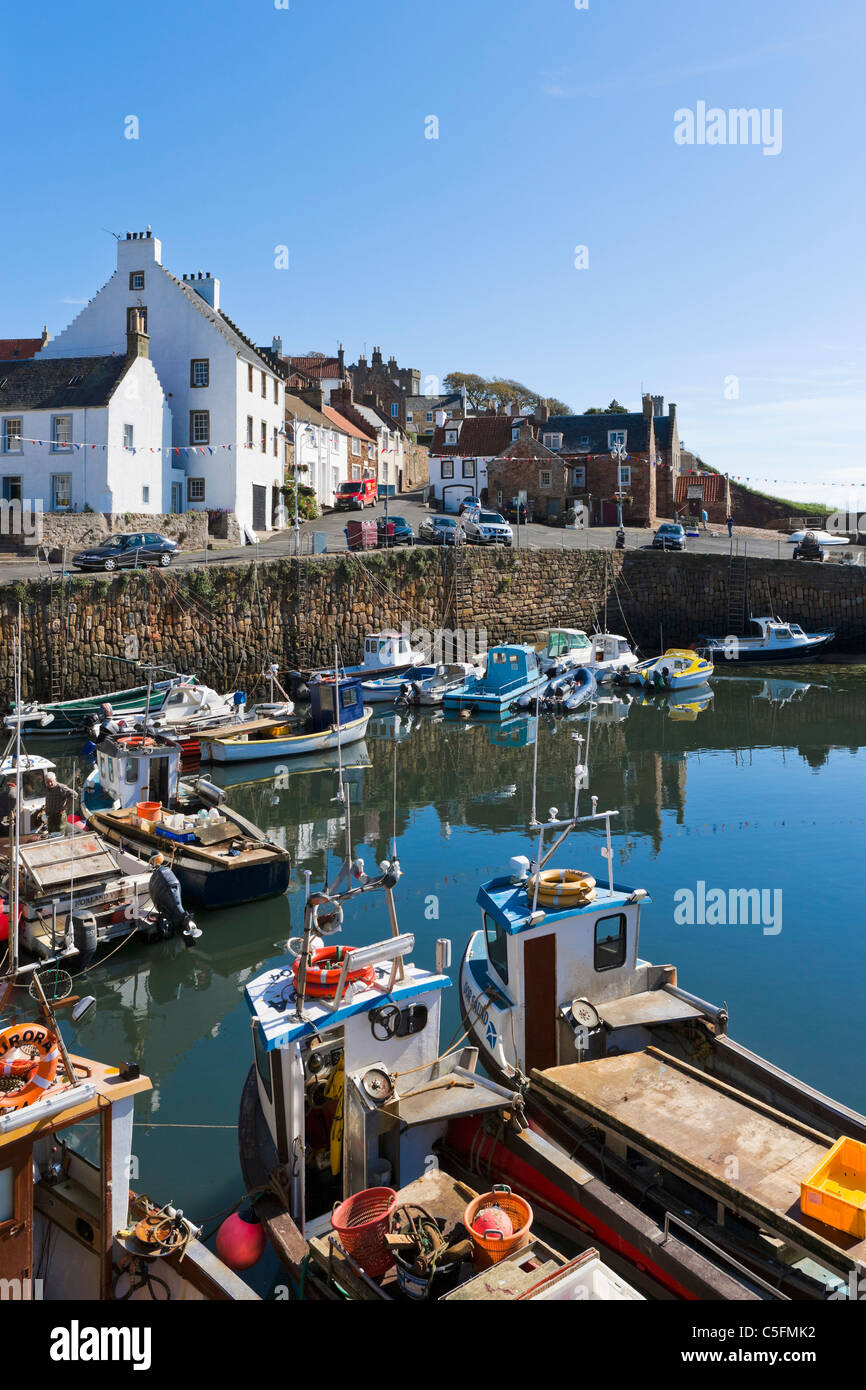 Local fishing boats in the harbour of the picturesque village of Crail ...