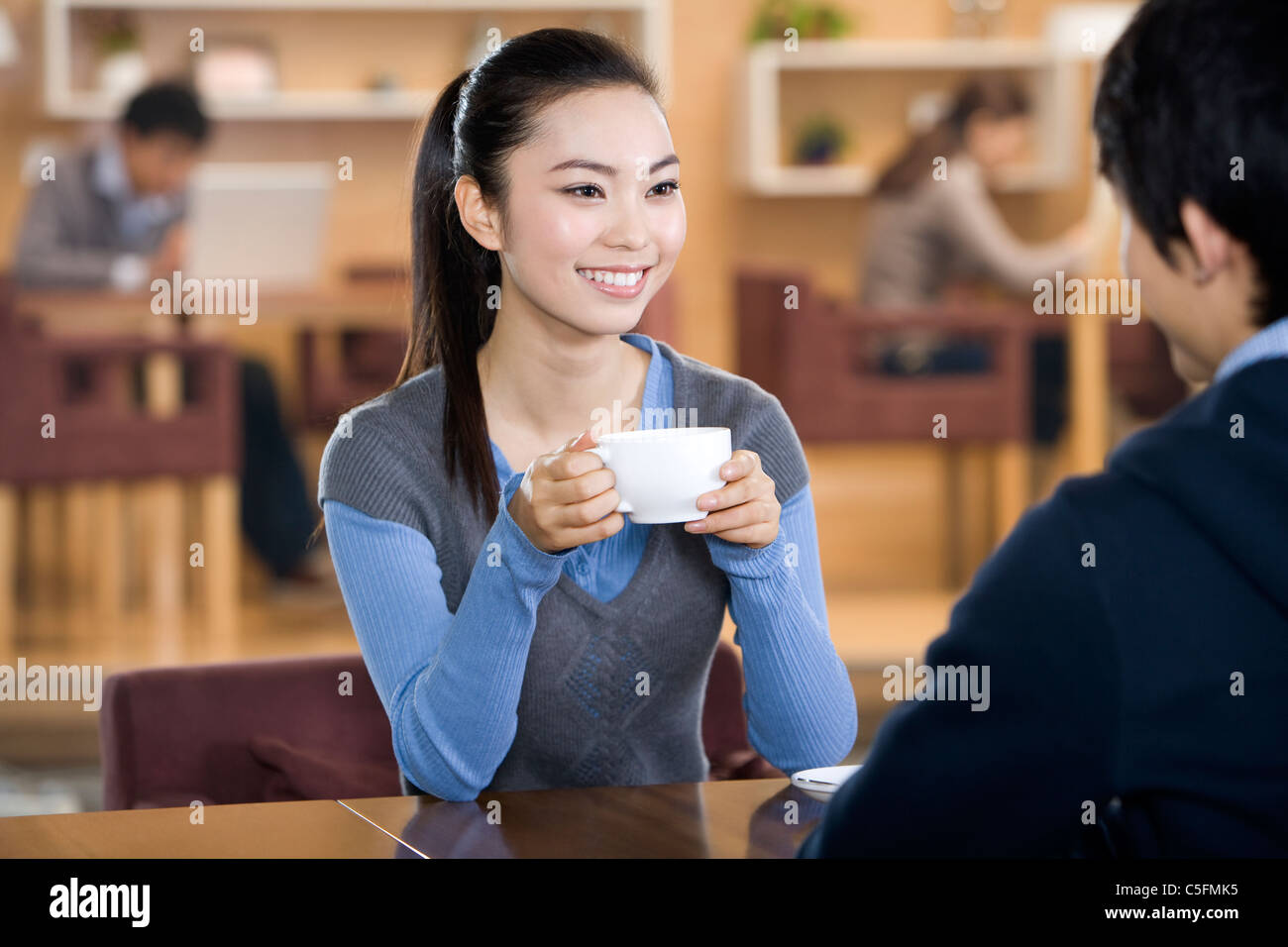 Man and woman talking over coffee Stock Photo - Alamy