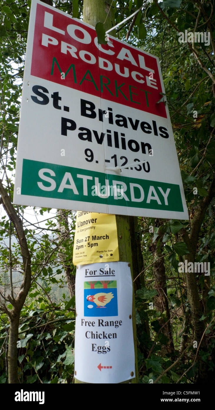 Local produce market signs on a telegraph pole outside the village of ...