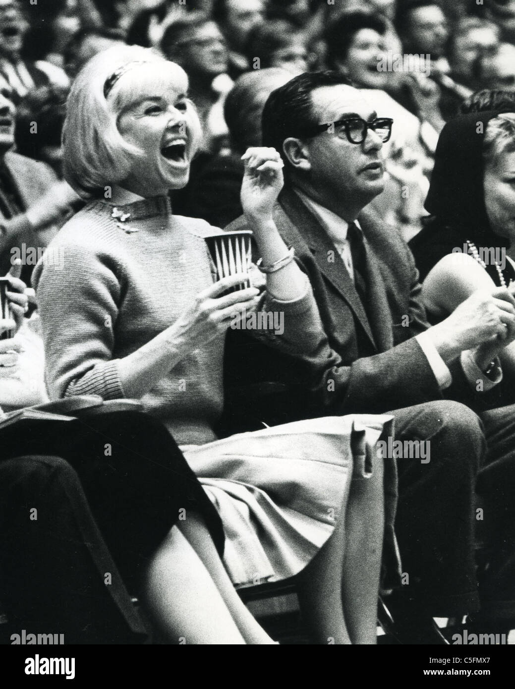 DORIS DAY with husband Marty Melcher at a basket ball game about 1964 ...