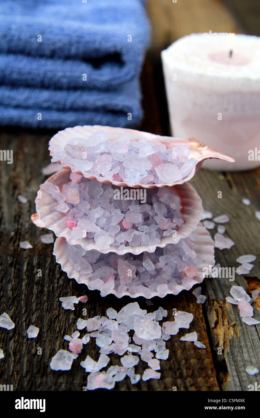 Spa still life .Bath lilac salt, towel and candle Stock Photo - Alamy