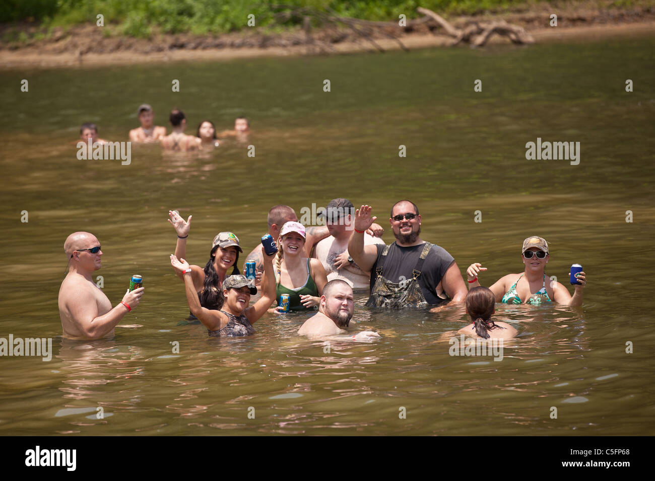 People take a break from the heat in the Oconee River during the annual ...