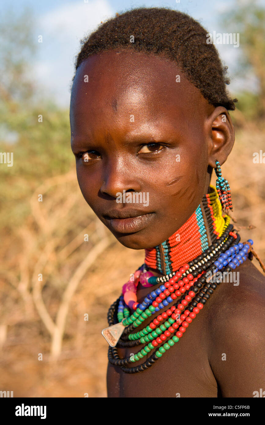 Portrait of a tribes-girl at a village near Turmi in the Lower Omo ...