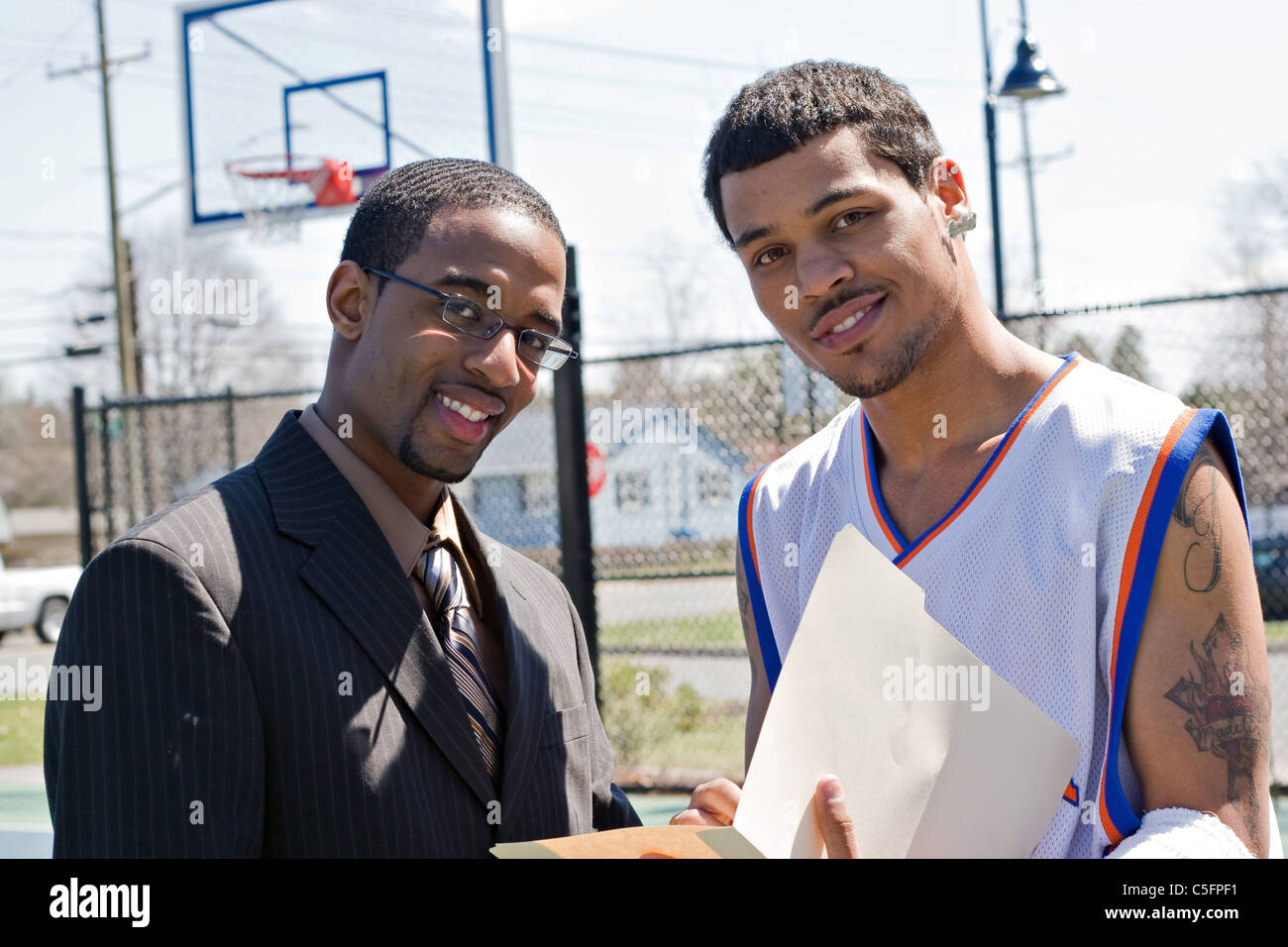 Basketball coach coaching his player Stock Photo - Alamy