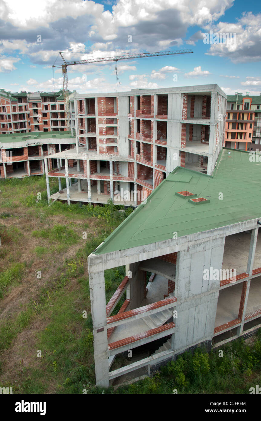 Construction industry and cran. Building with a sharp angle Stock Photo ...