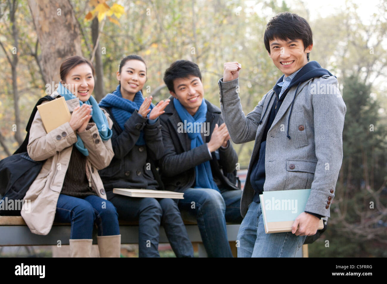 Friends cheering the success of a friend Stock Photo - Alamy