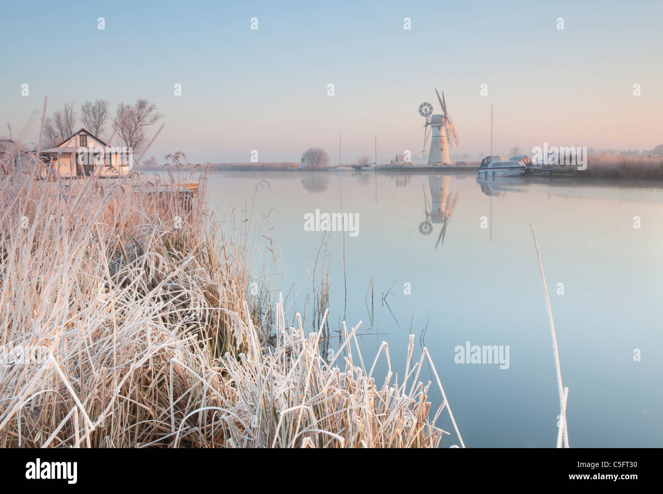 Thurne Drainage Mill reflecting in the River Thurne on the Norfolk ...