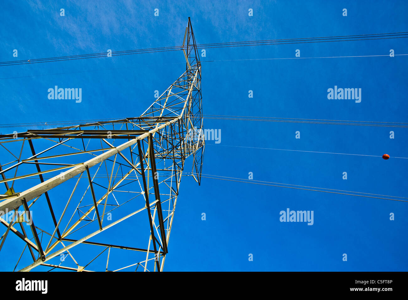Huge metal towers hold up very heavy transmission lines south of ...