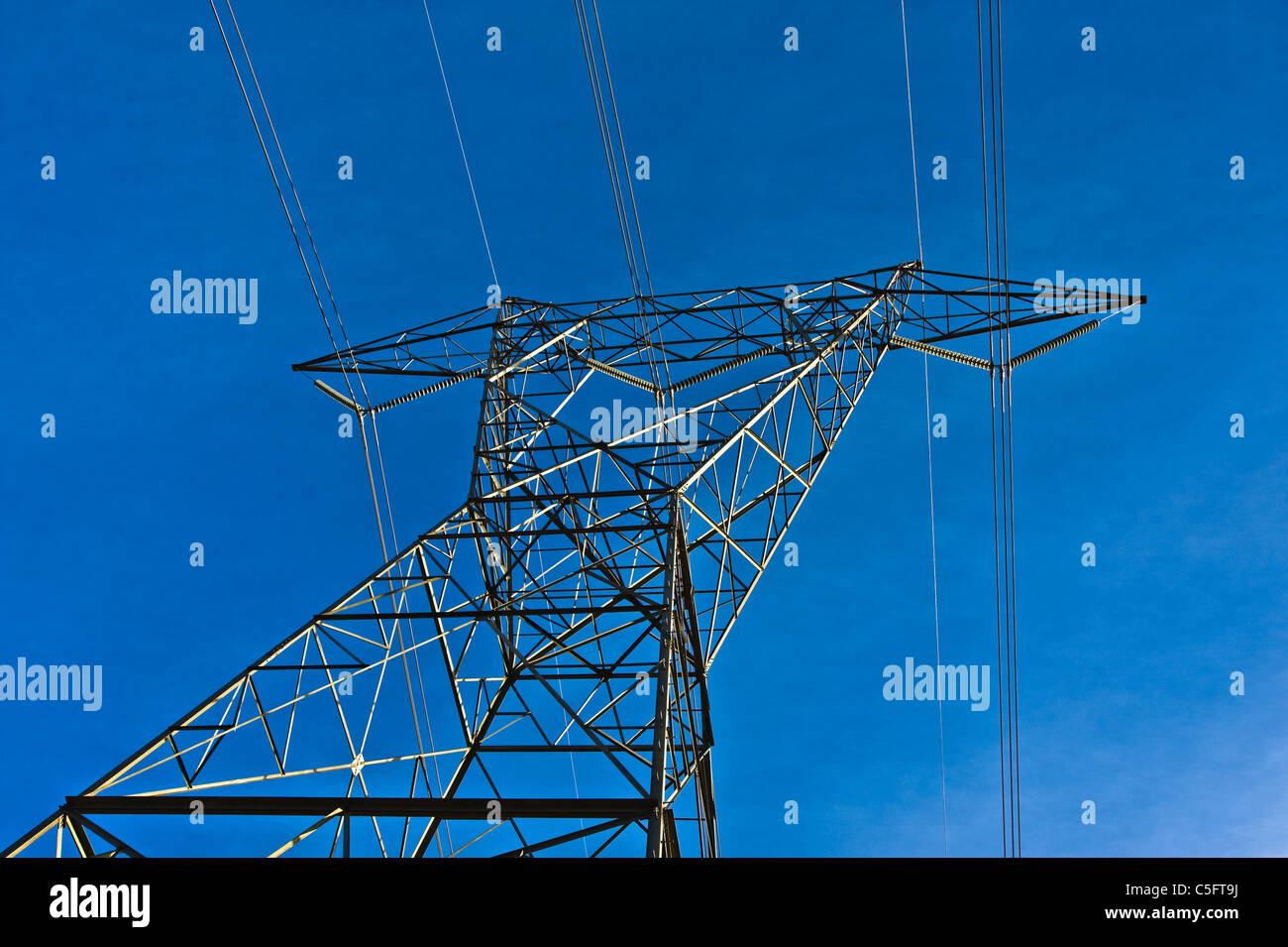 Huge metal towers hold up very heavy transmission lines south of ...
