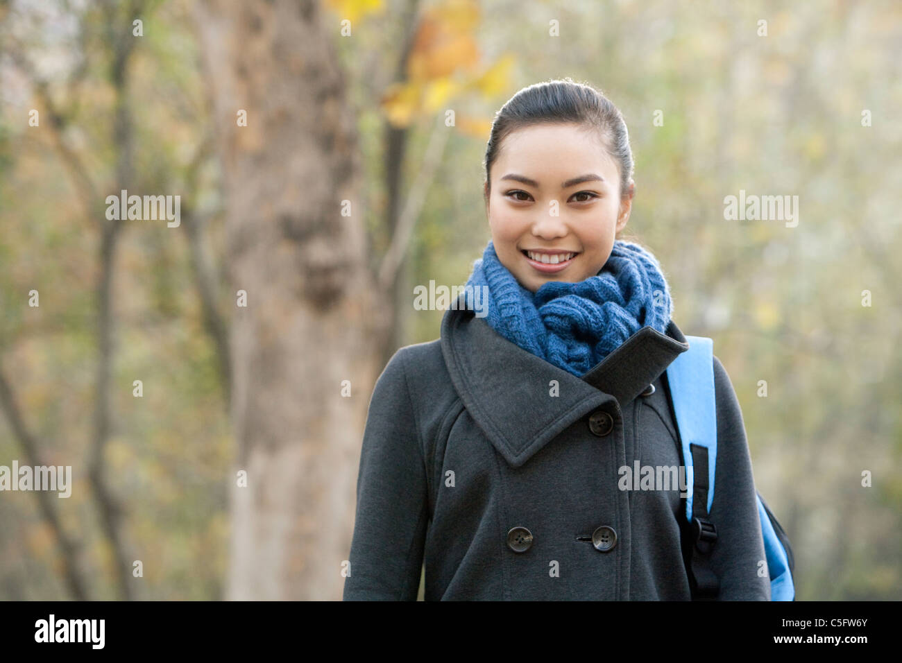 A young student smiling at the camera, outdoors Stock Photo - Alamy